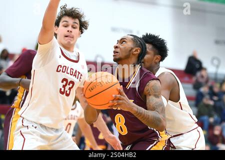Colgate forward Sam Wright (33), right, maneuvers against Michigan ...