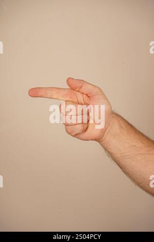 The index finger points forward with intent, drawing attention to ...