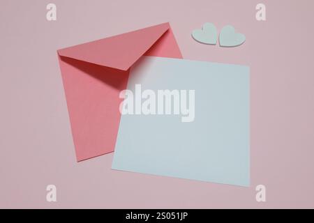 Composition with blank card, paper hearts and gift boxes on color ...