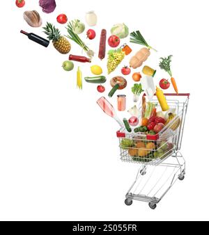 Many different products falling into shopping cart on white background ...