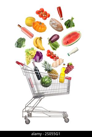Many different products falling into shopping cart on white background ...
