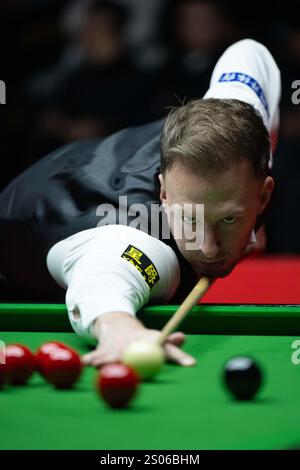 Judd Trump of England plays a shot to Tom Ford of England in their ...