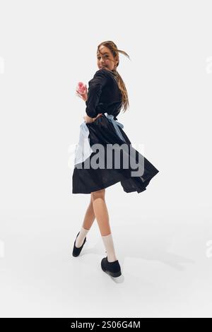 Excited waiter in black apron pointing fingers down, checking out promo ...