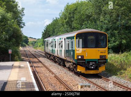 West Midlands Railway class 150 sprinter train 150139 passing Church ...