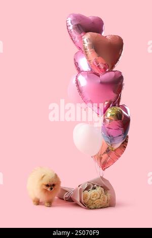 White dog with roses and balloons on pink background with space for ...