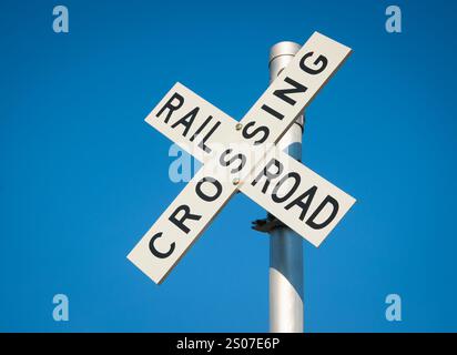 Roadway railroad crossing sign for oncoming trains warning Stock Photo ...