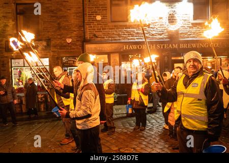 Haworth, West Yorkshire, UK: A torchligh procession is held in December ...