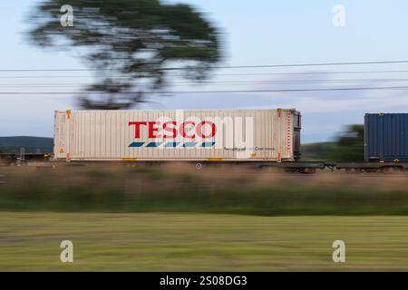 Tesco intermodal container being carried on a freight train at high ...