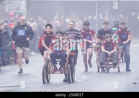 Boxing Day Pram Race in Crewkerne. Hundreds of locals line the streets ...