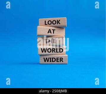 Look at the world wider symbol. Wooden blocks with words Look at the ...