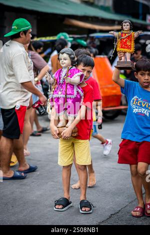 Filipino people celebrate an annual religious festival with a parade ...