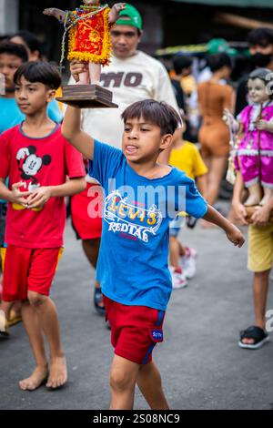 Filipino people celebrate an annual religious festival with a parade ...