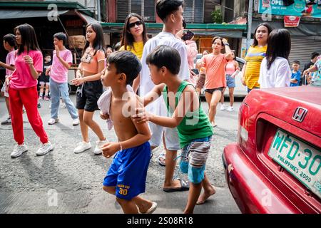 Filipino people celebrate an annual religious festival with a parade ...