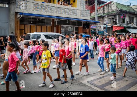 Filipino people celebrate an annual religious festival with a parade ...