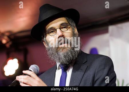 Rabbi Motte Wilhelm led the gathering. Hundreds of people celebrated ...