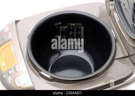 Inside the rice cooker with the lid open. Kitchen equipment electronic ...