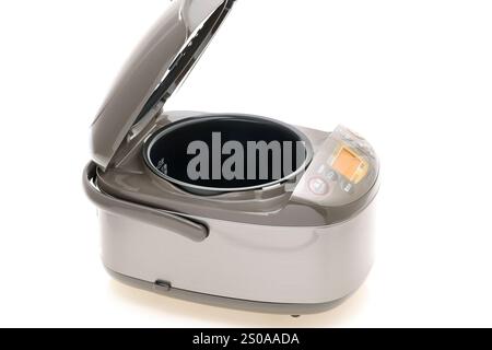 Inside the rice cooker with the lid open. Kitchen equipment electronic ...