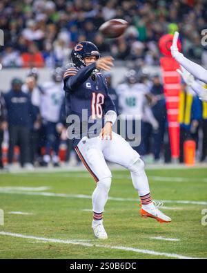 Chicago Bears quarterback Caleb Williams puts on his helmet during the ...