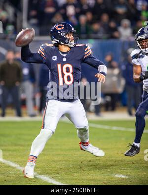 Chicago Bears quarterback Caleb Williams poses for photos as he waits ...