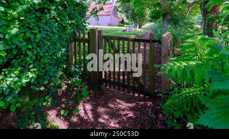 Terwick, UK - June 17, 2024: St Peter's Chapel and the Lupin field ...