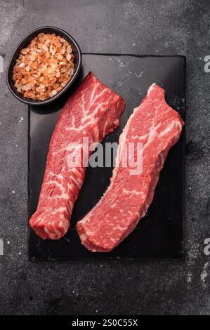 Raw Tri Tip Steak from Black Angus beef meat with rosemary. wooden ...