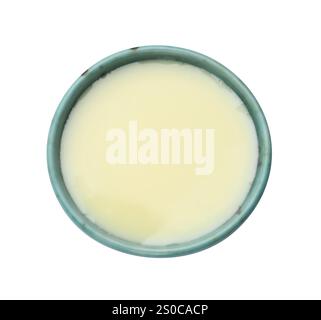 Condensed milk in bowl isolated on white Stock Photo - Alamy