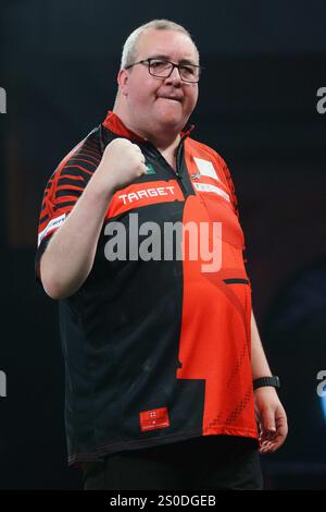 Madars Razma celebrating winning the second round match between Darren ...