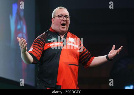 Madars Razma celebrating winning the second round match between Darren ...