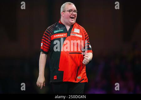 Madars Razma celebrating during the second round match between Darren ...