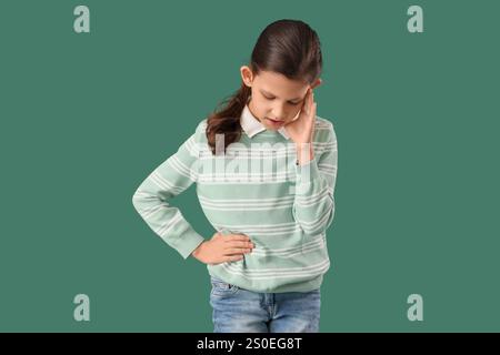 Teenage girl with appendicitis on green background Stock Photo - Alamy