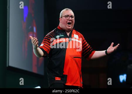 Madars Razma celebrating winning the second round match between Darren ...