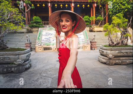 Follow me to Long Son pagoda in Nha Trang. A female tourist in a ...