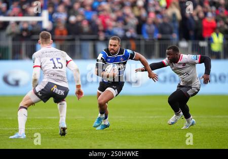 Bath's Ollie Lawrence breaks the tackle of Saracens' Olly Hartley ...
