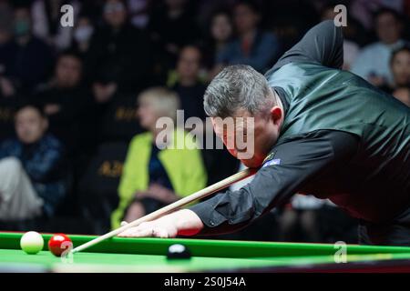 Ronnie O'Sullivan of England plays a shot to Anthony Hamilton of ...