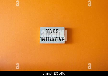 Take initiative symbol. Wooden blocks with words Take initiative ...