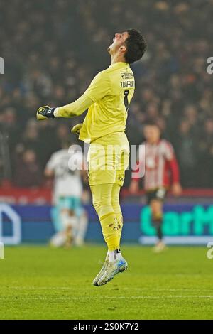 Burnley goalkeeper James Trafford celebrates with team-mate Bashir ...