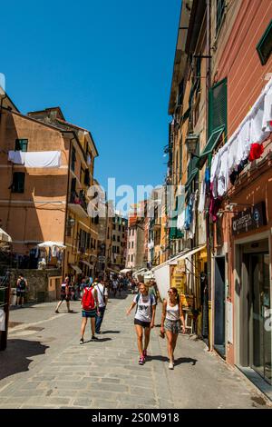via roma street in genoa,italy,decorated with colorful umbrellas on top ...