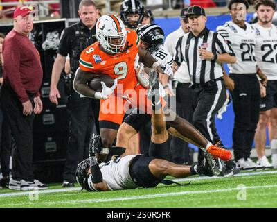 Miami tight end Elija Lofton (9) leaves the field after a loss to Iowa ...