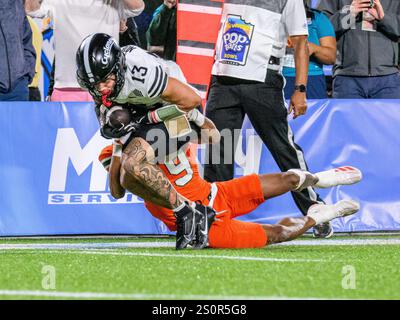 Miami defensive lineman Tyler Baron (9) smiles after an NCAA football ...