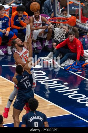 New York Knicks guard Jalen Brunson, center, watches during the New ...