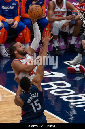 New York Knicks guard Jalen Brunson, center, watches during the New ...