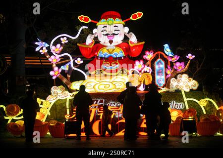People enjoy the festive lanterns in the snow in Xi'an City Wall, Xi'an ...