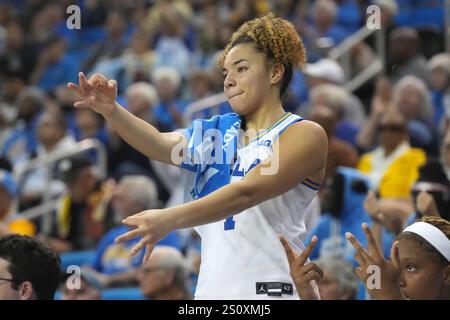 UCLA guard Kiki Rice gestures to teammates during the first half of an ...