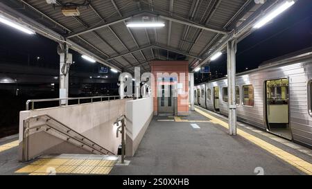 Night view of the Kagoshima Main Line platform inside Yawata Station ...