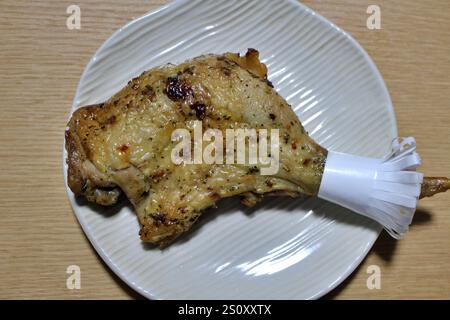 Roasted chicken leg purchased at a supermarket in Tokyo, Japan Stock ...