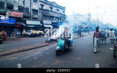 A pile of rubish burning in the middle of the street in Lucknow, India ...