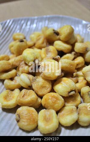 Deep fried Peruvian corn snack Stock Photo - Alamy
