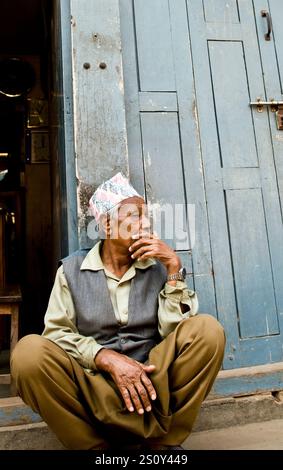 A Nepali man wearing the traditional dhaka topi hat in the medieval ...