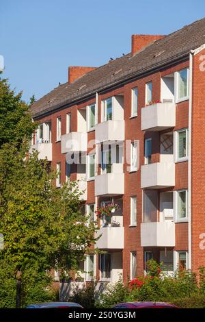Monotonous modern brick residential building with balconies, multi ...