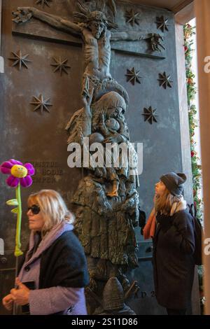 Pilgrims pass through the Holy Door of St. Peter's Basilica during the ...